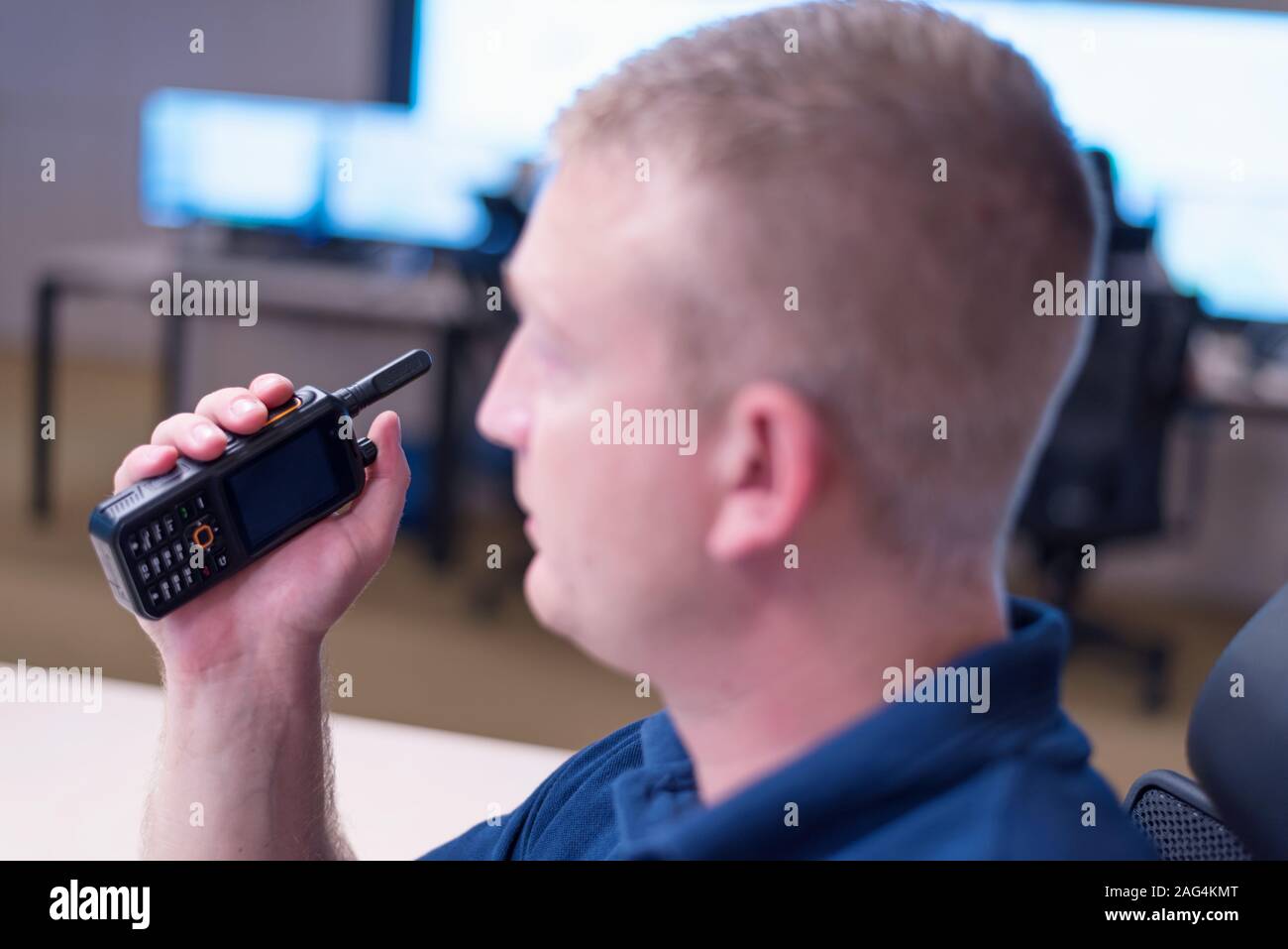 Security guard monitoring modern CCTV cameras in surveillance room ...