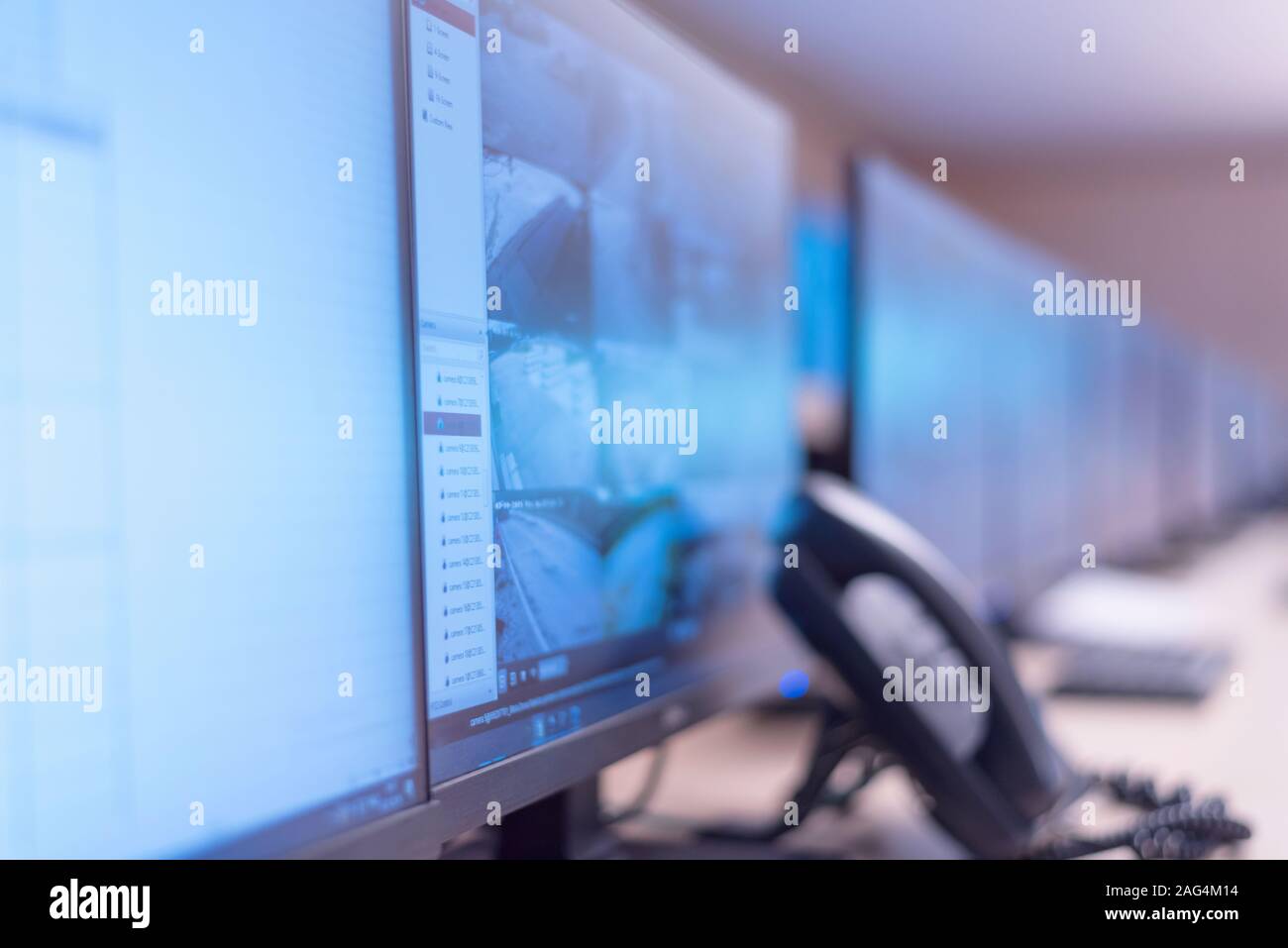 Security guard monitoring modern CCTV cameras in surveillance room ...
