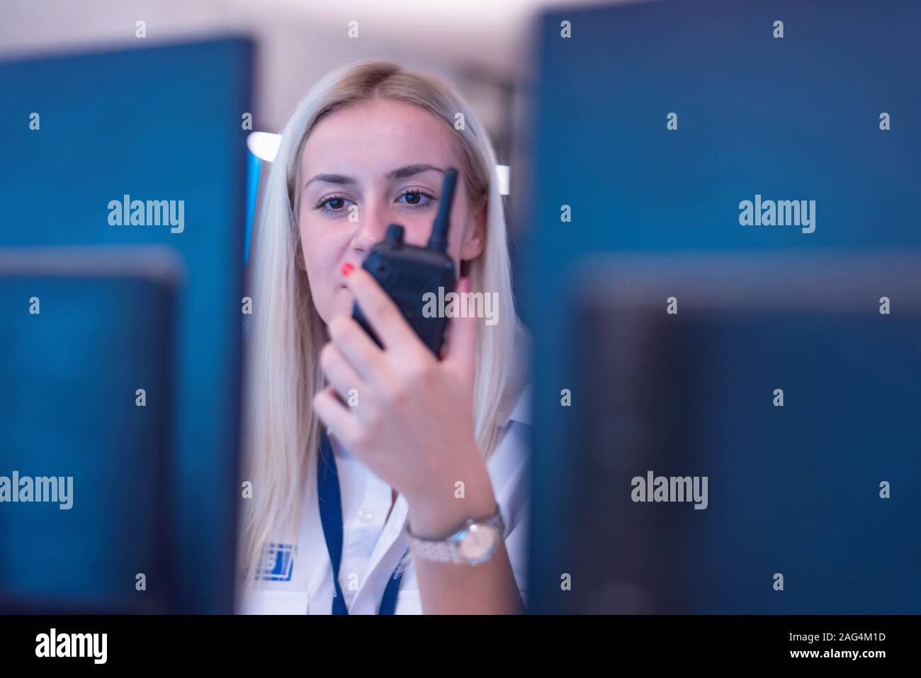 Security guard monitoring modern CCTV cameras in surveillance room ...