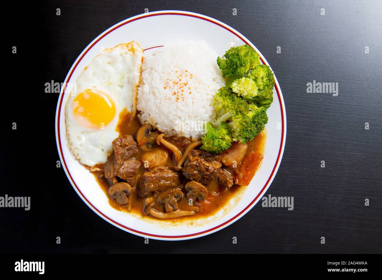 beef Curry Rice on black wooden background ( Onsen tamago, Potato ...