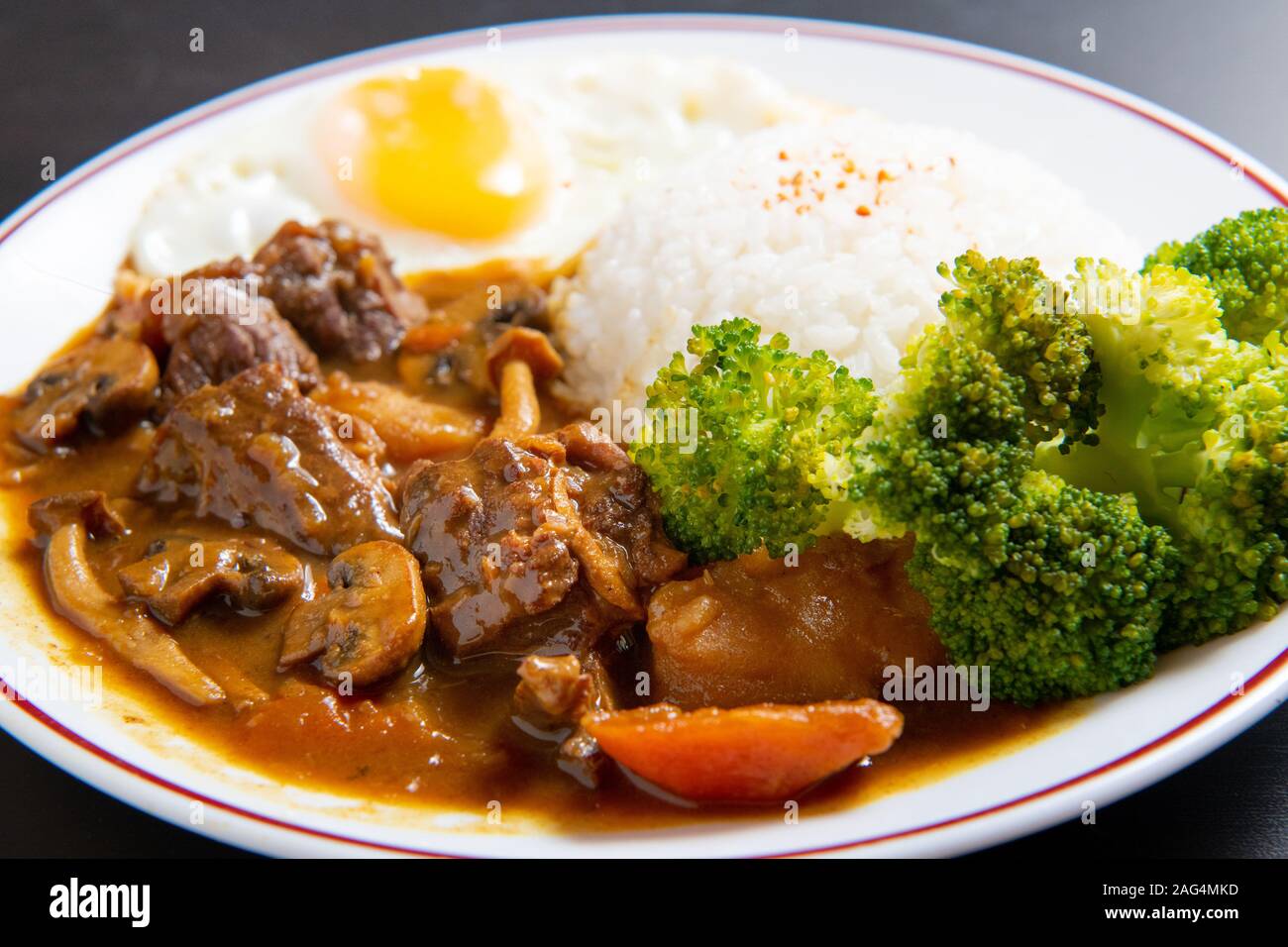 beef Curry Rice on black wooden background ( Onsen tamago, Potato ...