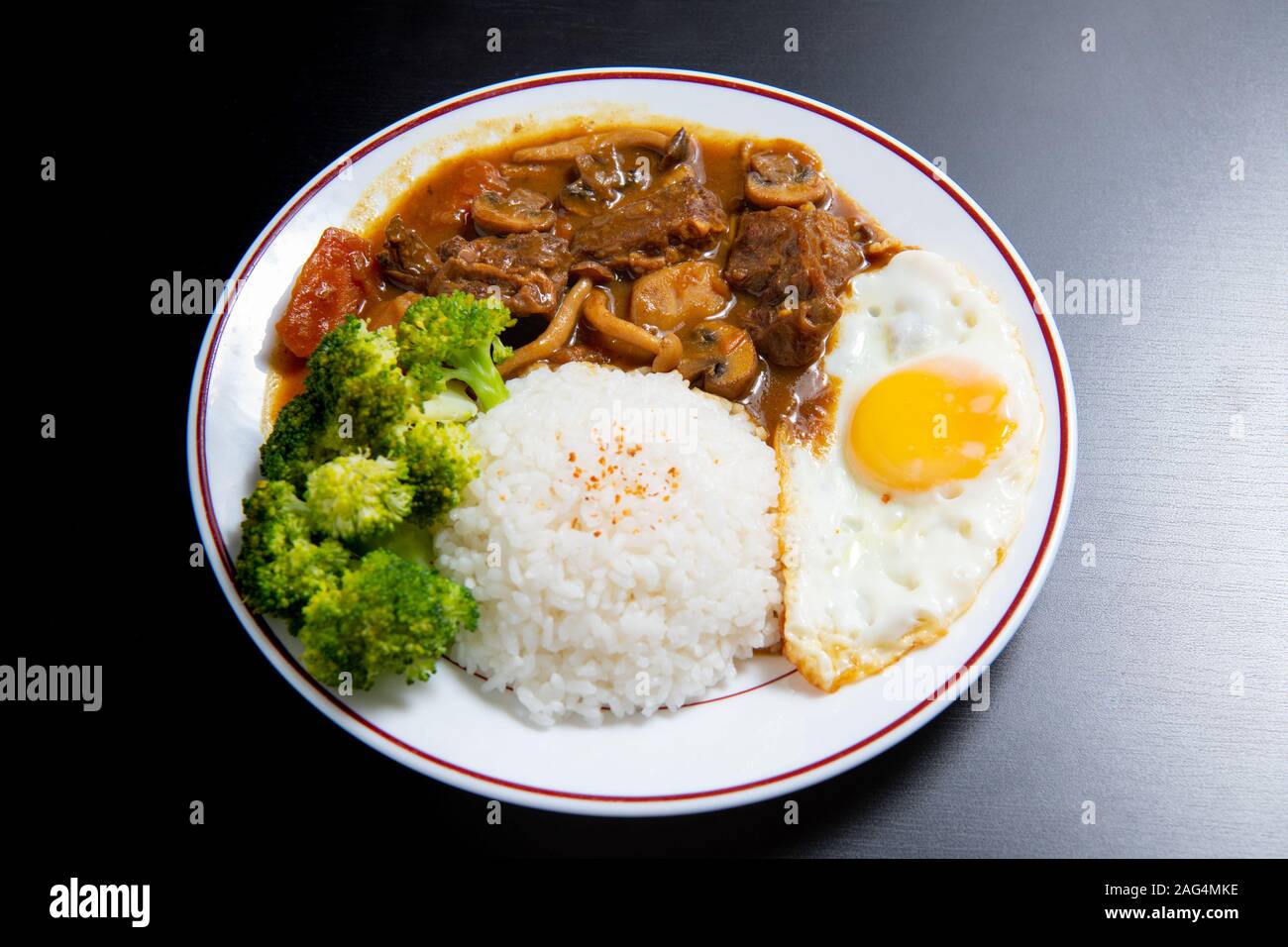 beef Curry Rice on black wooden background ( Onsen tamago, Potato ...