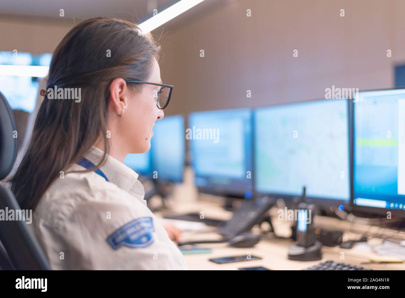 Security guard monitoring modern CCTV cameras in surveillance room ...