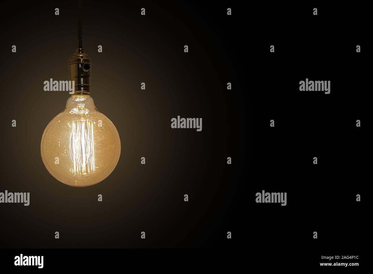 Closeup shot of an old yellow lightbulb reflecting its light on the ...