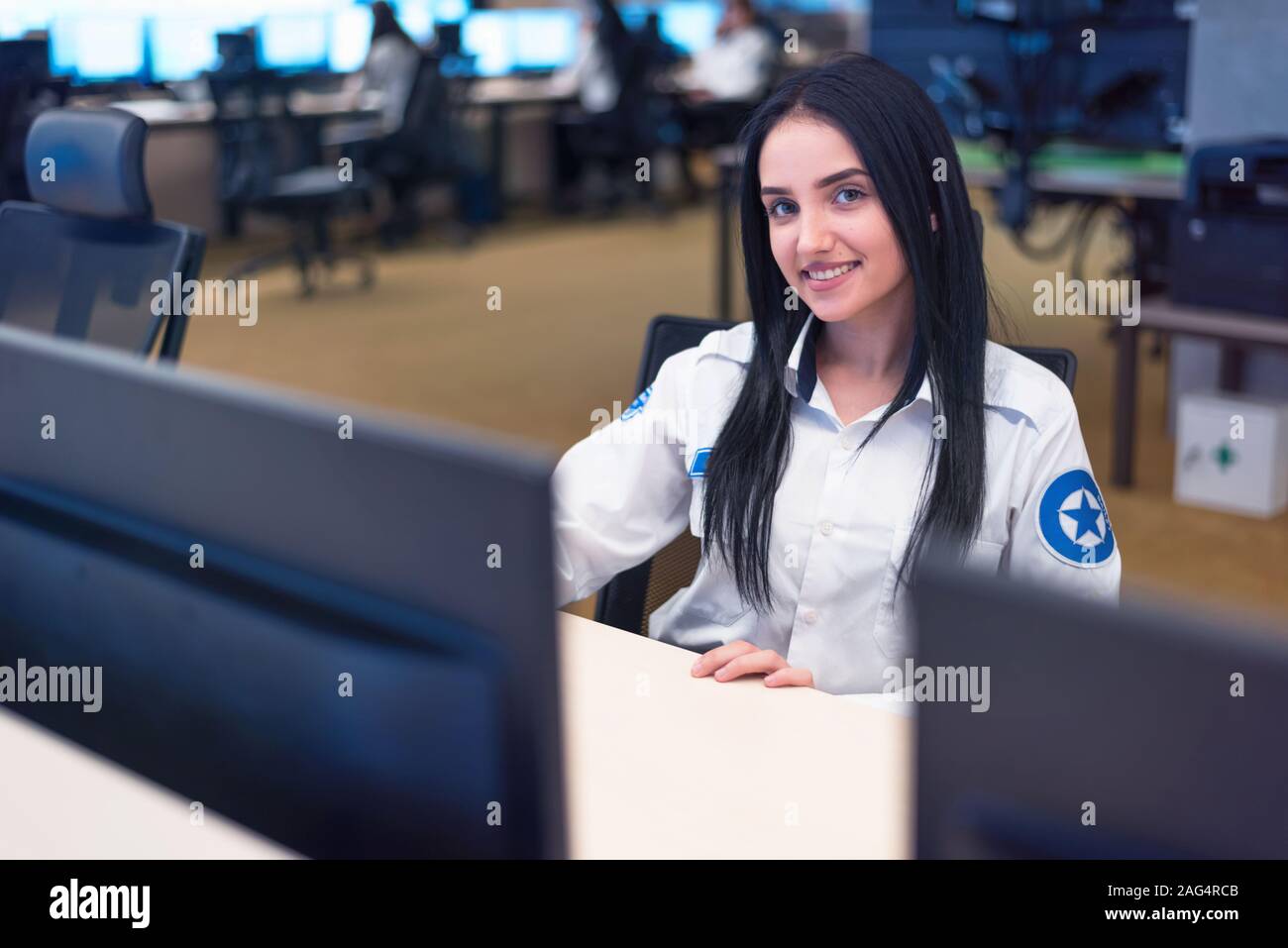 Security guard monitoring modern CCTV cameras in surveillance room ...
