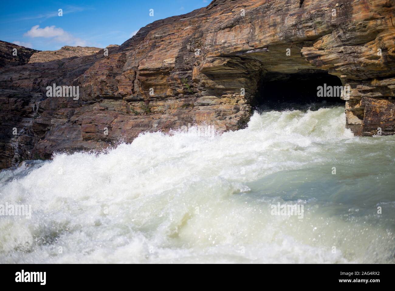 Beautiful shot of lumps of water pouring from the inside of a cave in a ...