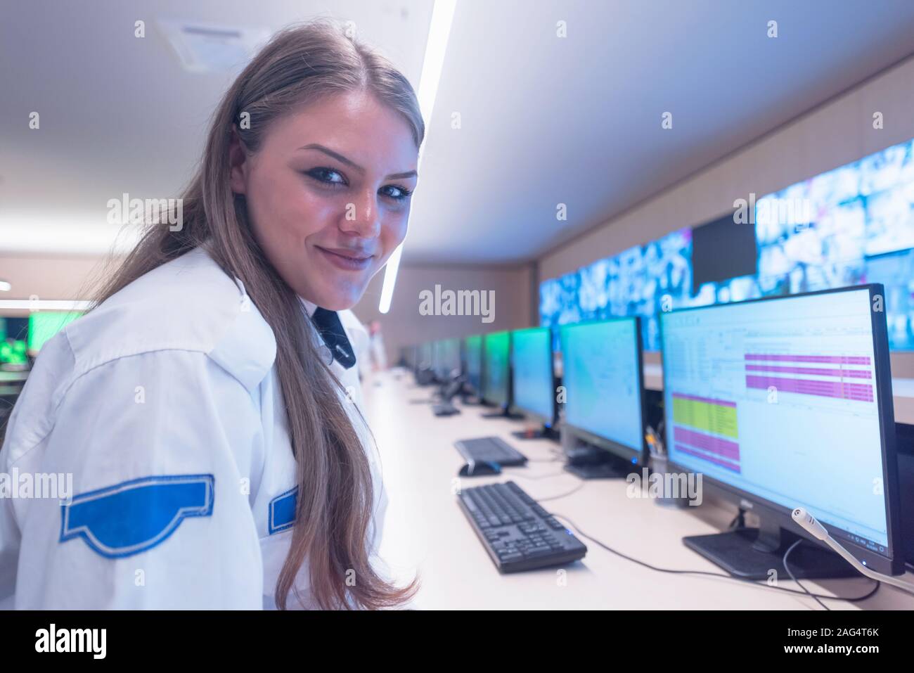 Security guard monitoring modern CCTV cameras in surveillance room ...