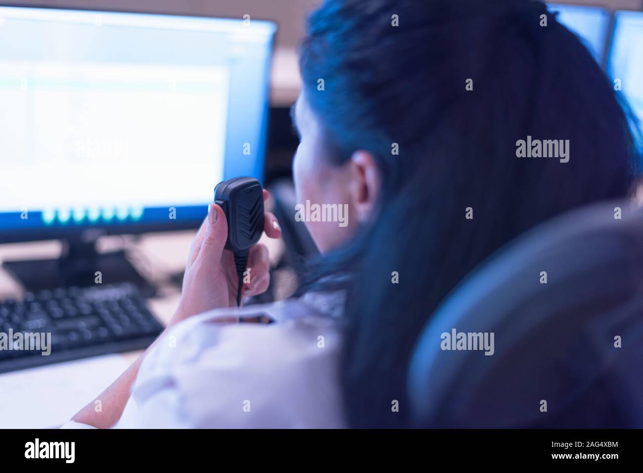 Security guard monitoring modern CCTV cameras in surveillance room ...