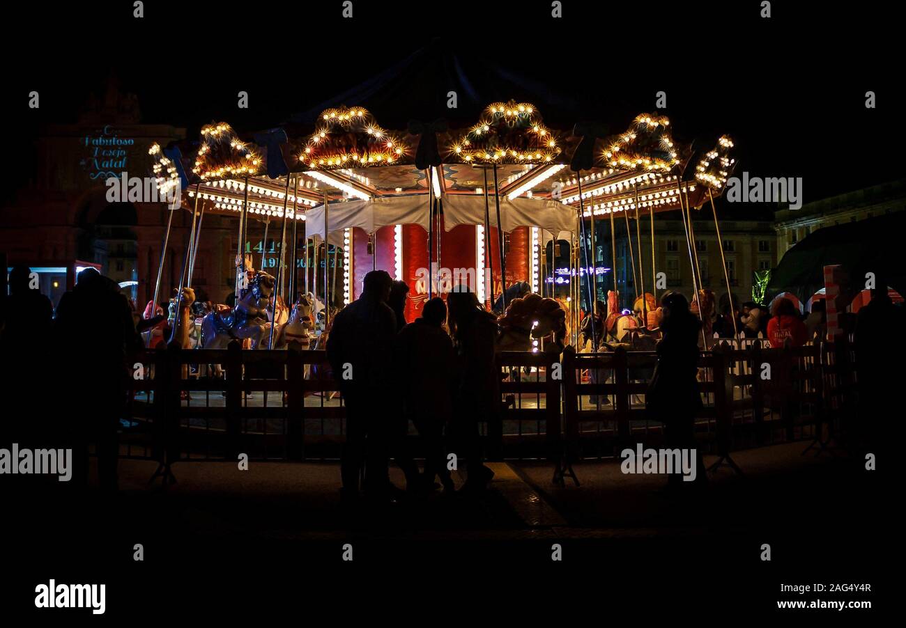 Lighted carousel in an amusement park at night Stock Photo - Alamy