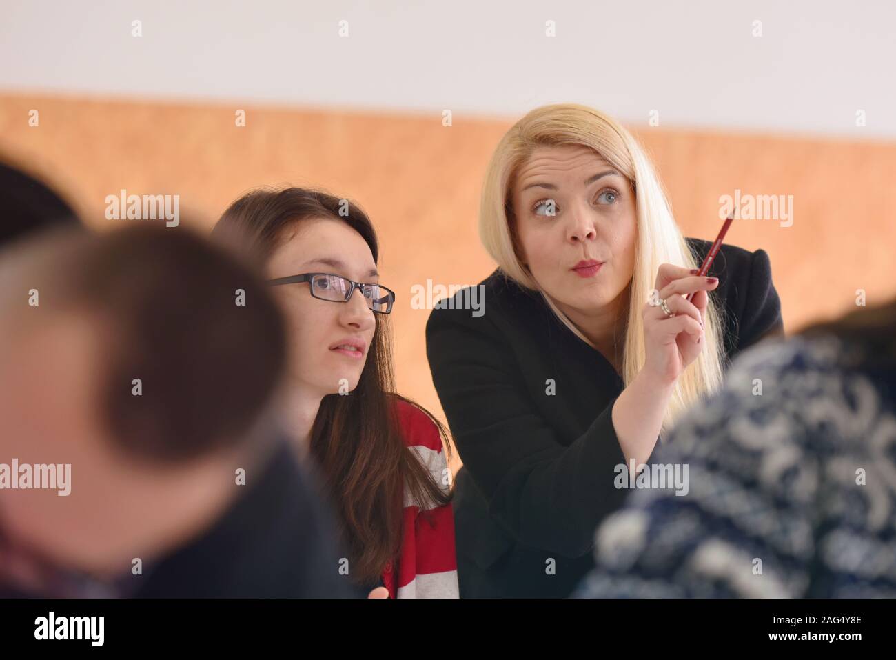 Beautiful female university professor of architecture explain lesson to ...