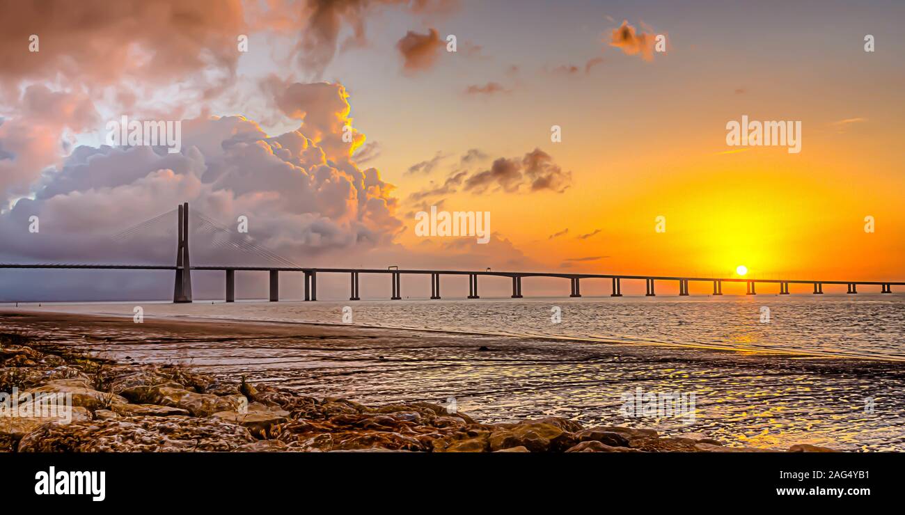 Beach, the sea and a bridge with the beautiful clouds and an amazing ...