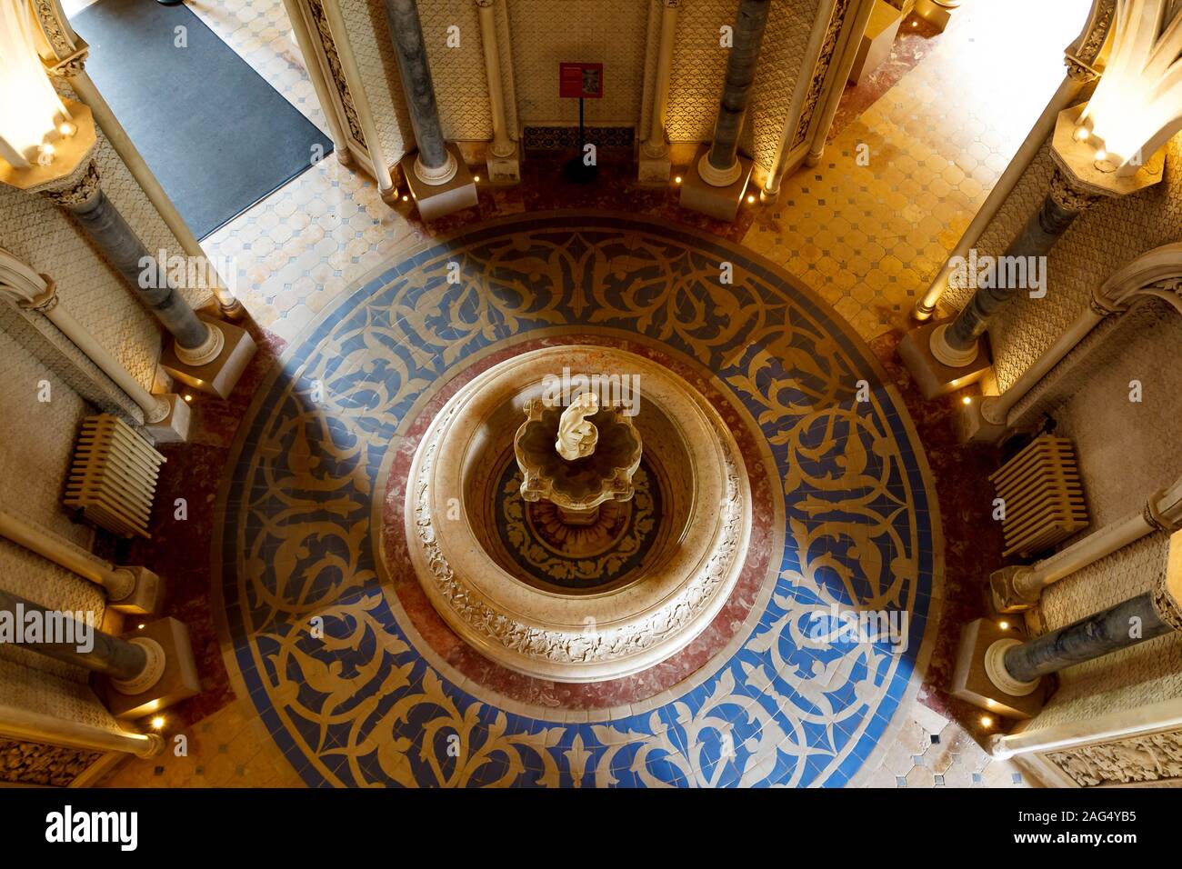 High angle shot of the inside of an old building with statues and ...