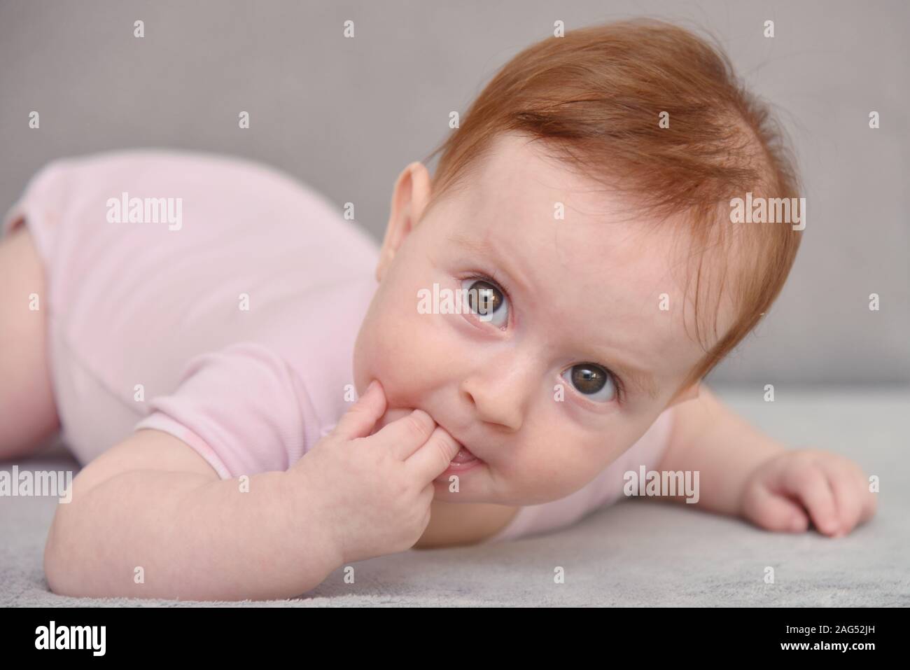 Happy Three Month Old Baby on White Background. Baby girl lying on her ...