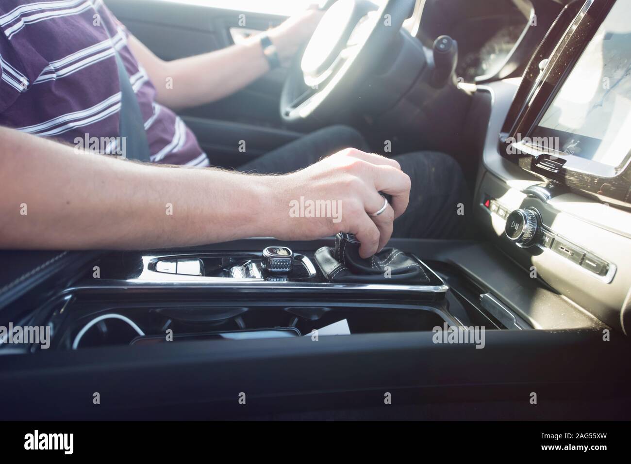 Man driving a car. Success in motion. Handsome young man driving a car ...
