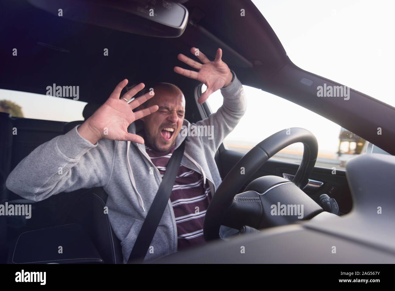 Shocked businessman driving car hi-res stock photography and images - Alamy