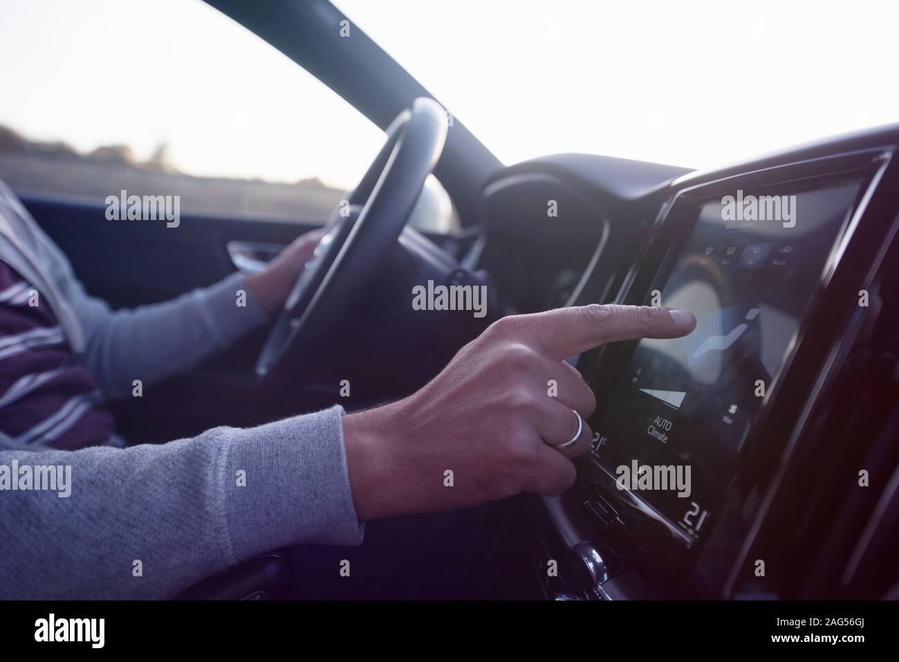 Driver man checking adjusting air conditioning the cooling system with ...