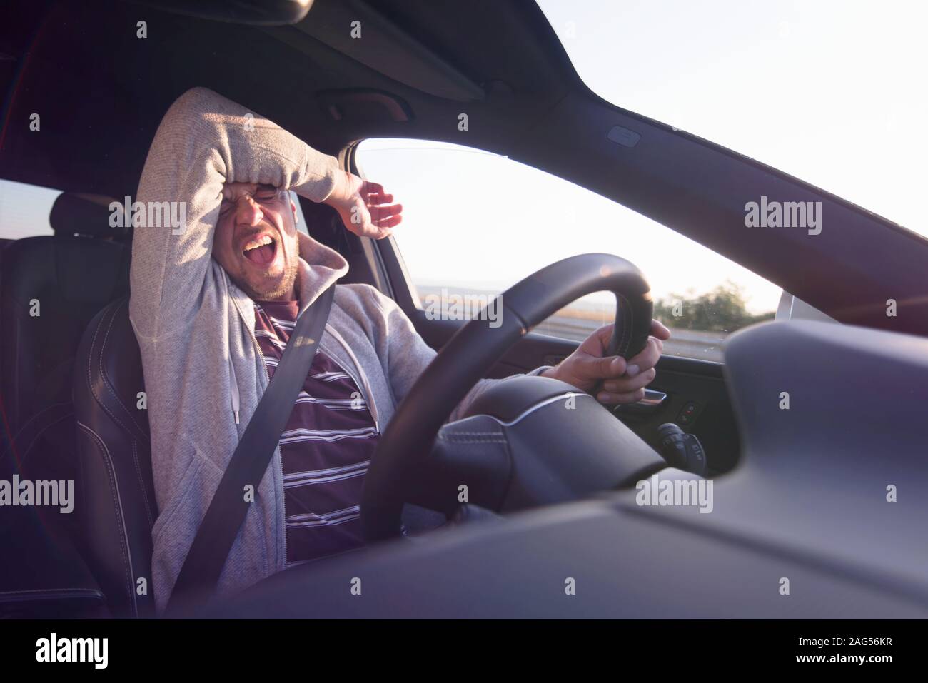 Shocked businessman driving car hi-res stock photography and images - Alamy
