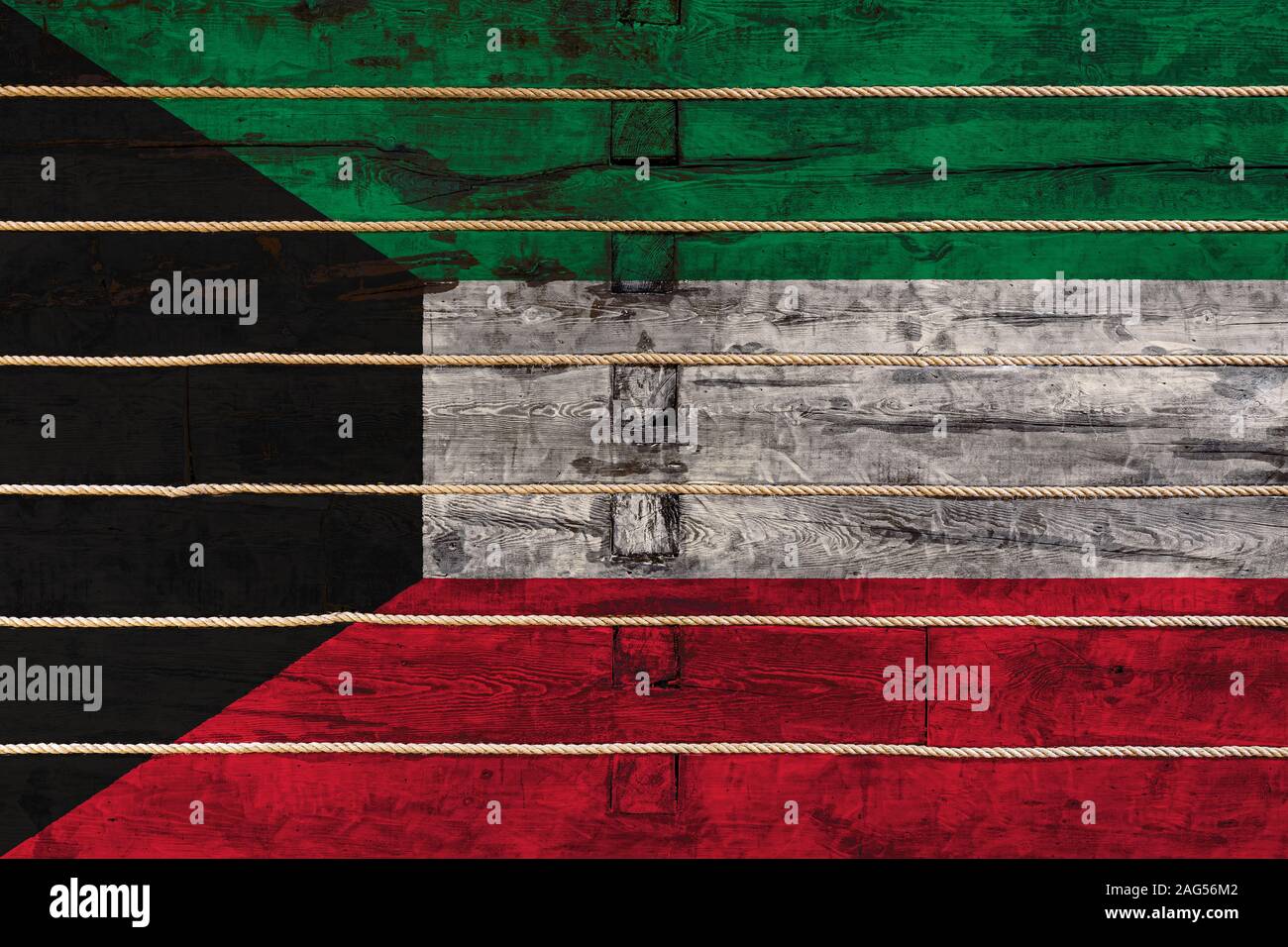 National flag of Kuwait on a wooden wall background. The concept of ...