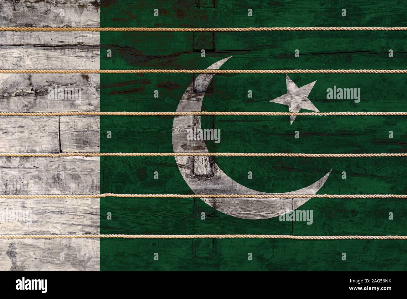 National flag of Pakistan on a wooden wall background. The concept of ...