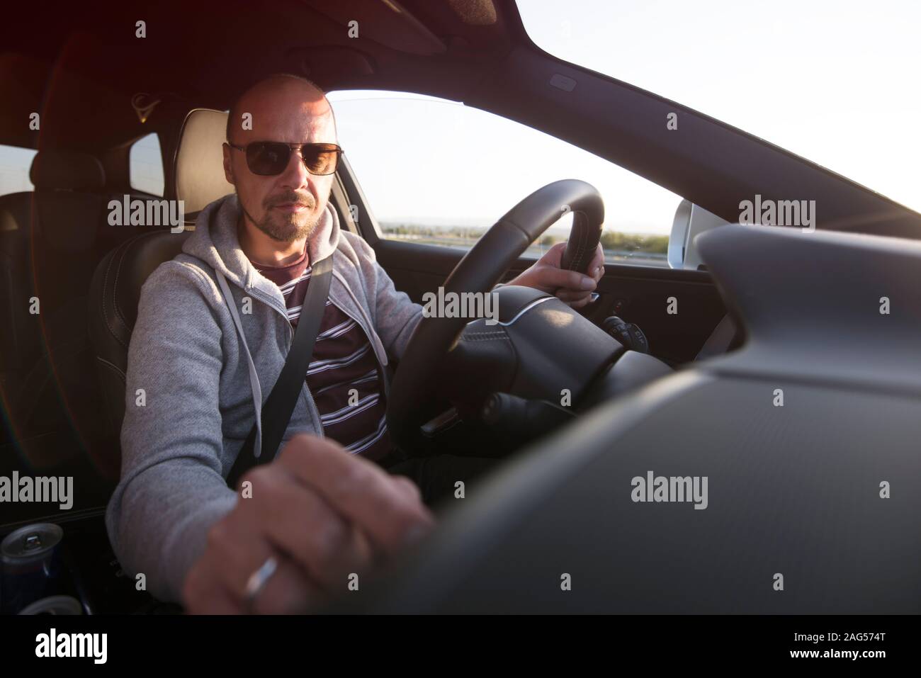 Driver man checking drive route on navigation monitor during drive ...