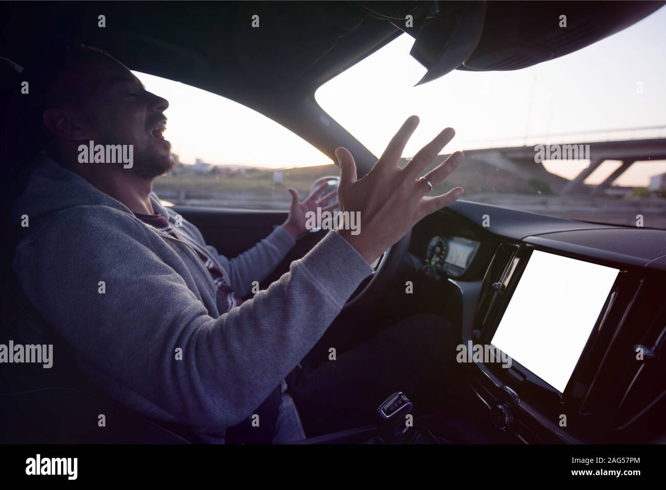 Shocked businessman driving car hi-res stock photography and images - Alamy