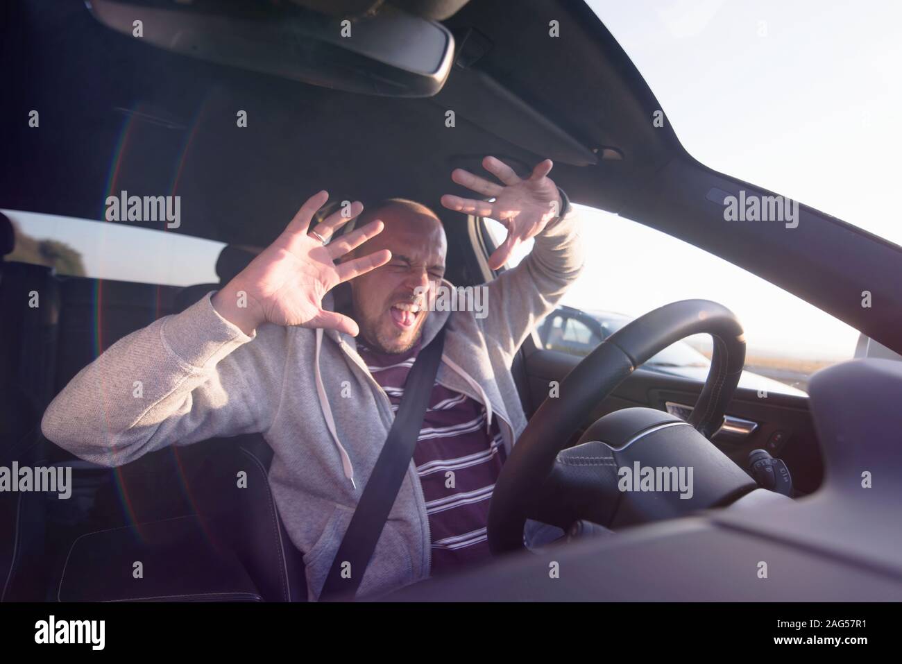 Shocked businessman driving car hi-res stock photography and images - Alamy