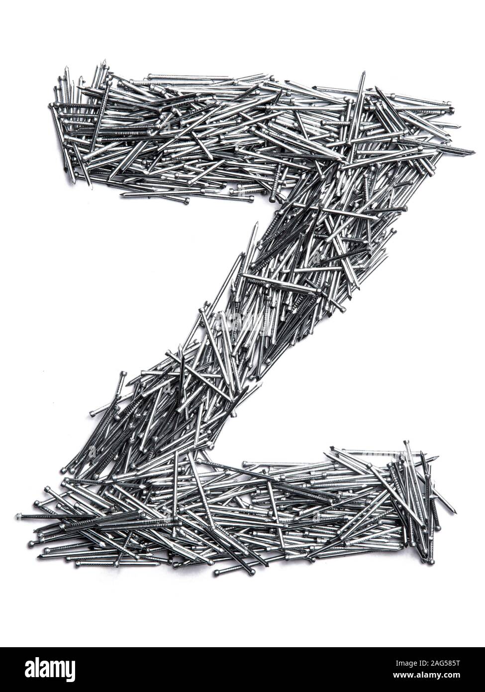 Letter Z of the English alphabet from small iron nails on a white ...