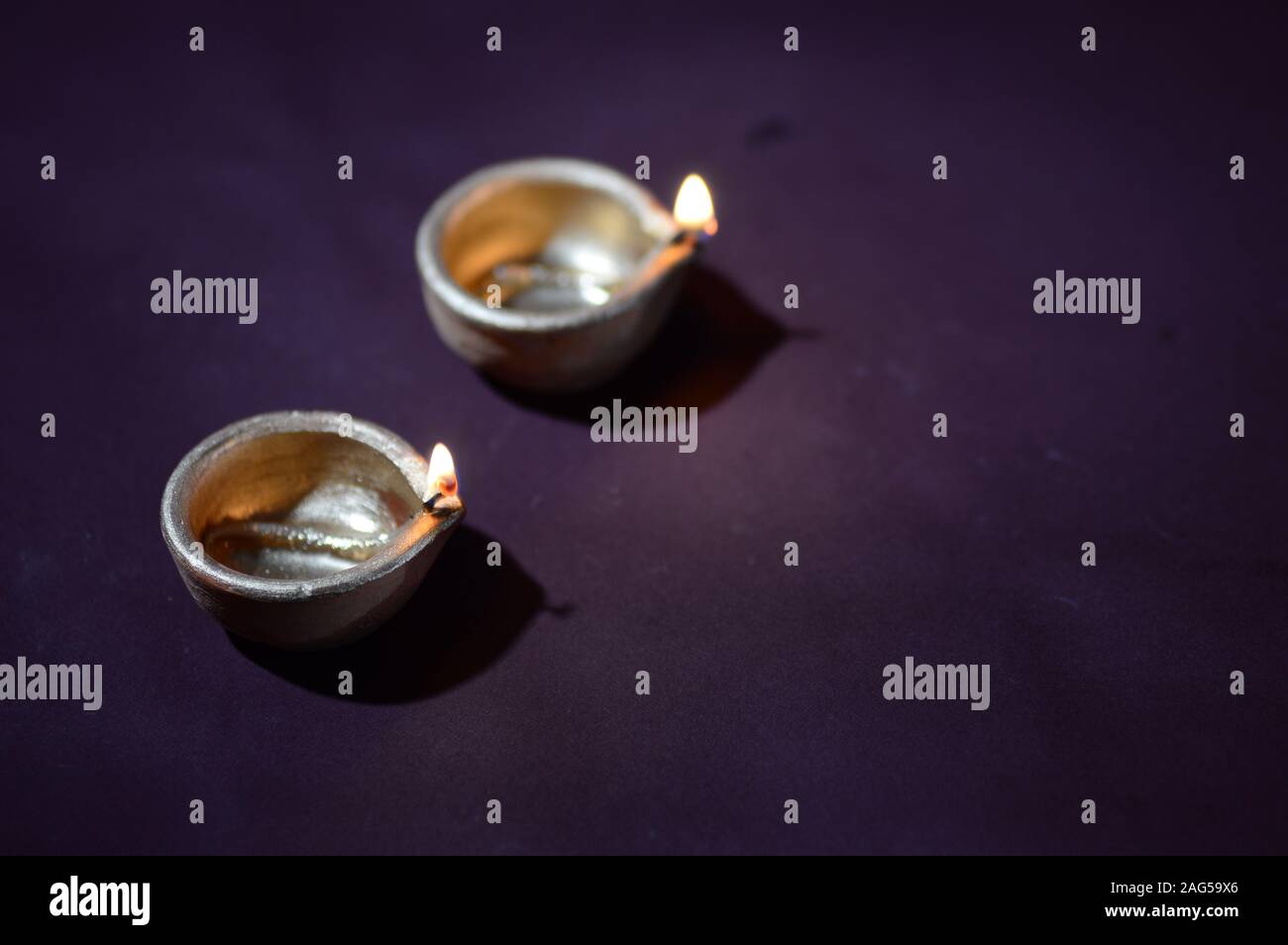 Colorful clay Diya (Lantern) lamps lit during Diwali celebration ...