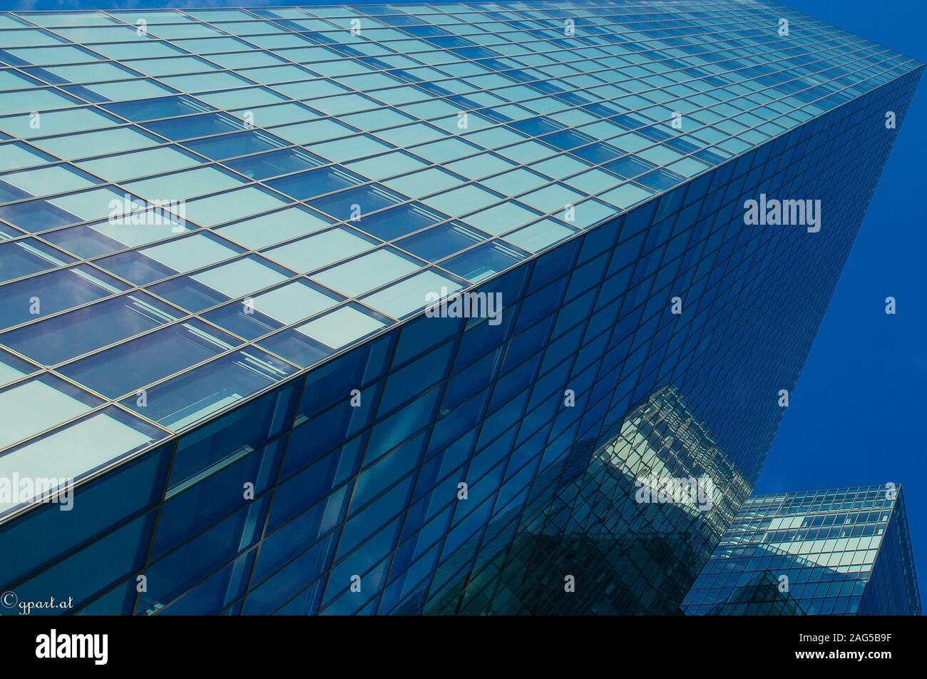 Low angle incline shot of a huge modern architecture skyscraper with ...