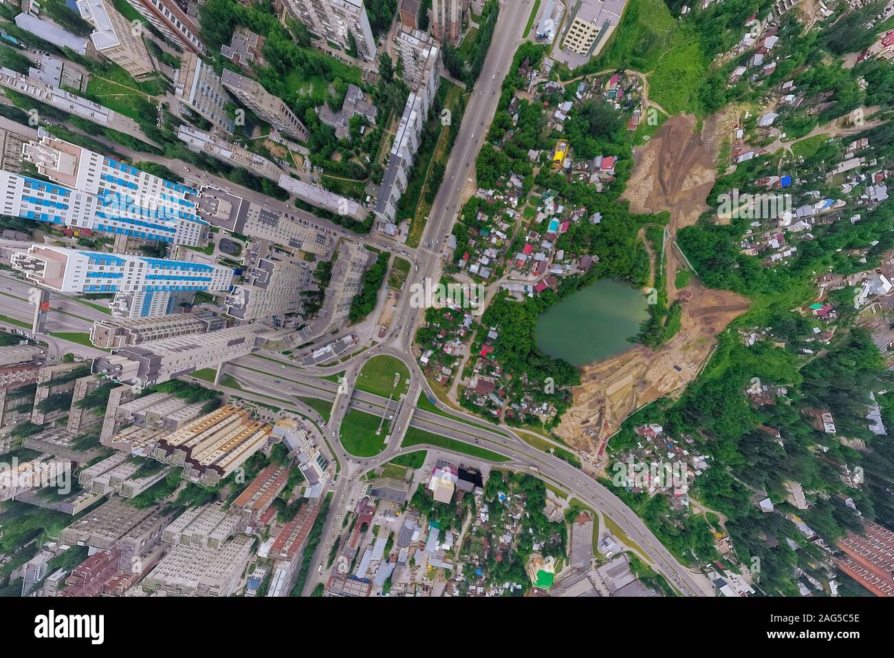Aerial view of square in the city with roundabout traffic, streets and ...