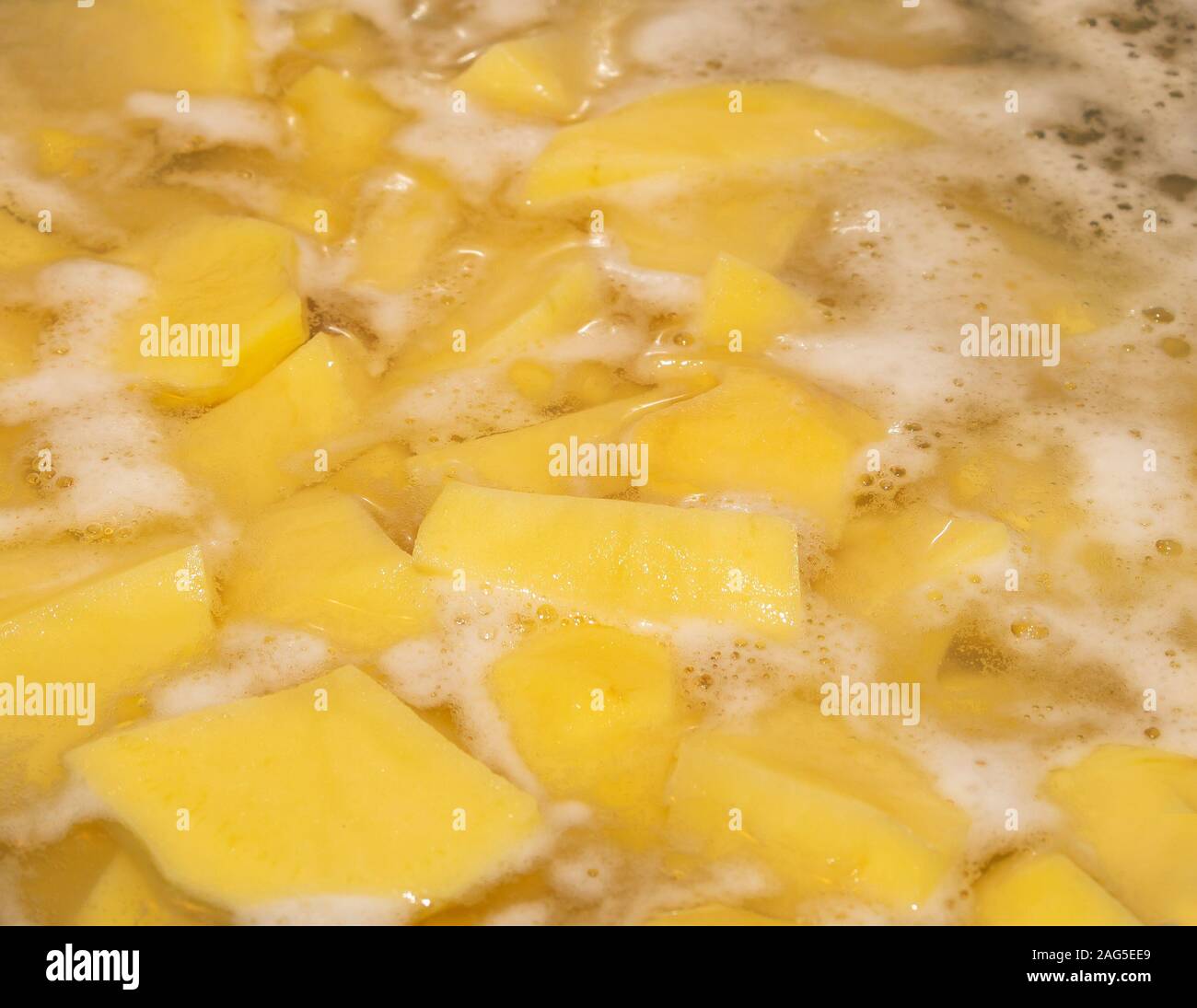 Potatoes in boiling process. Healthy food concept Stock Photo - Alamy