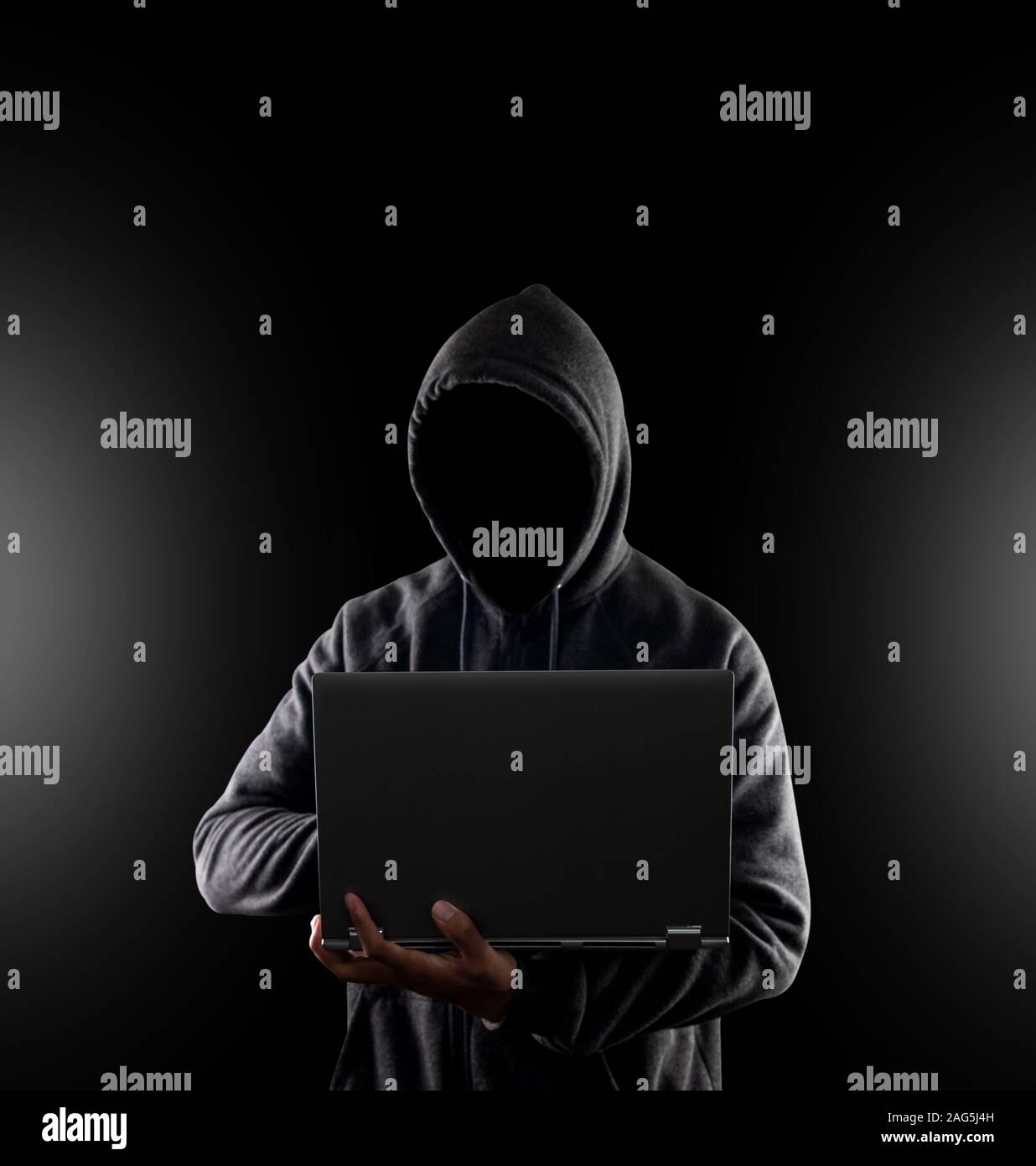 Cybercrime, hacking and technology crime. no face hacker with laptop on ...