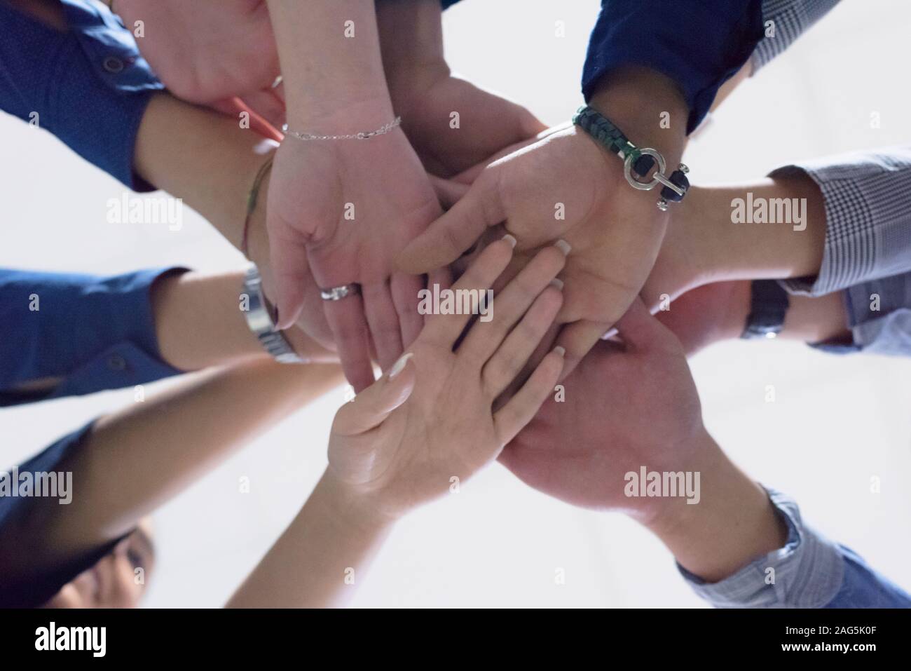 College Students Teamwork Stacking Hand Concept. Close up of young ...