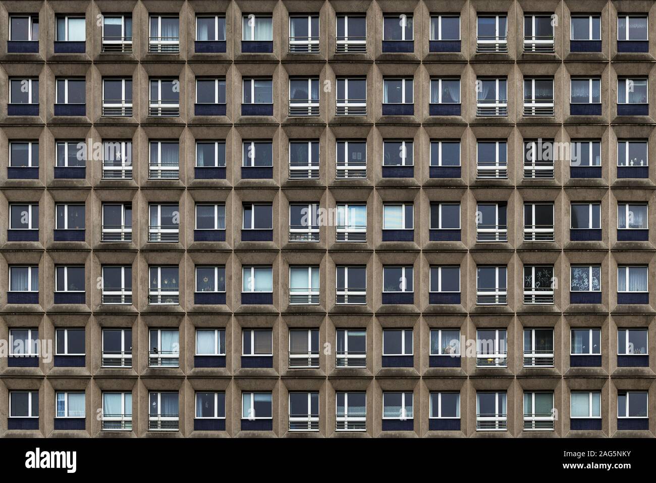 Modern building with glass windows silently witnessing the life of the ...