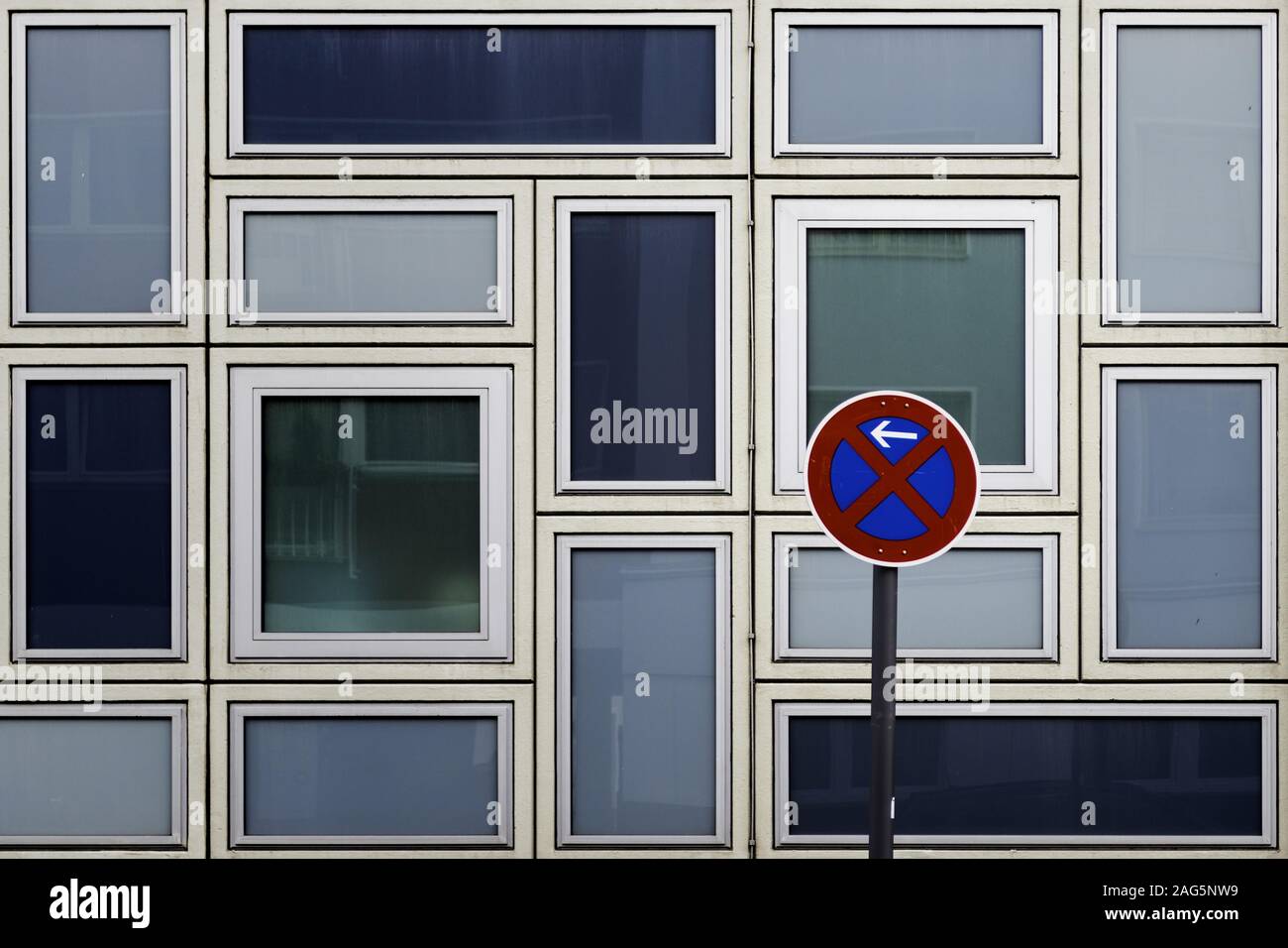 Modern building with blue and white windows of different shapes and ...