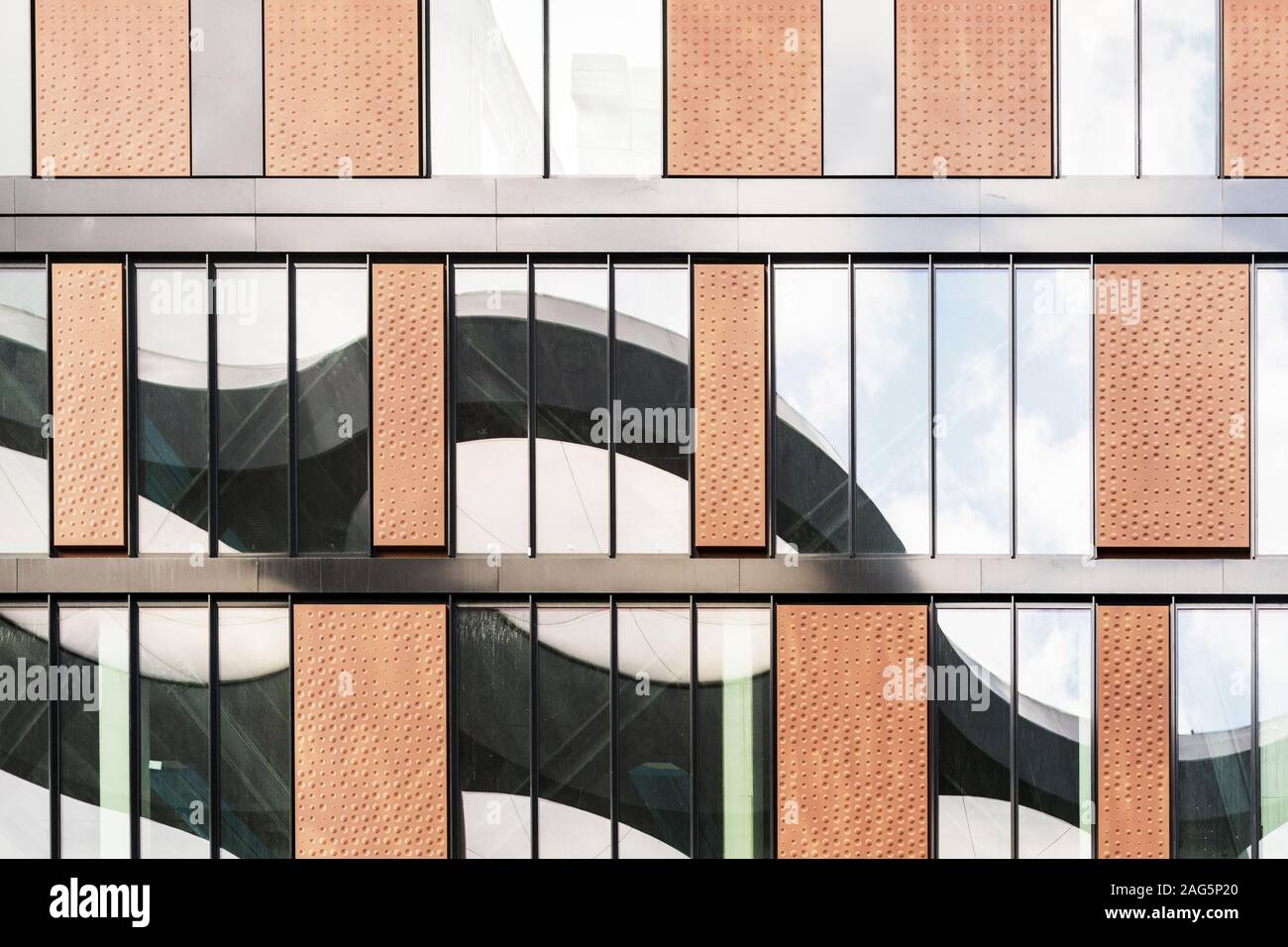 Interesting architectural twist on a modern building with glass windows ...