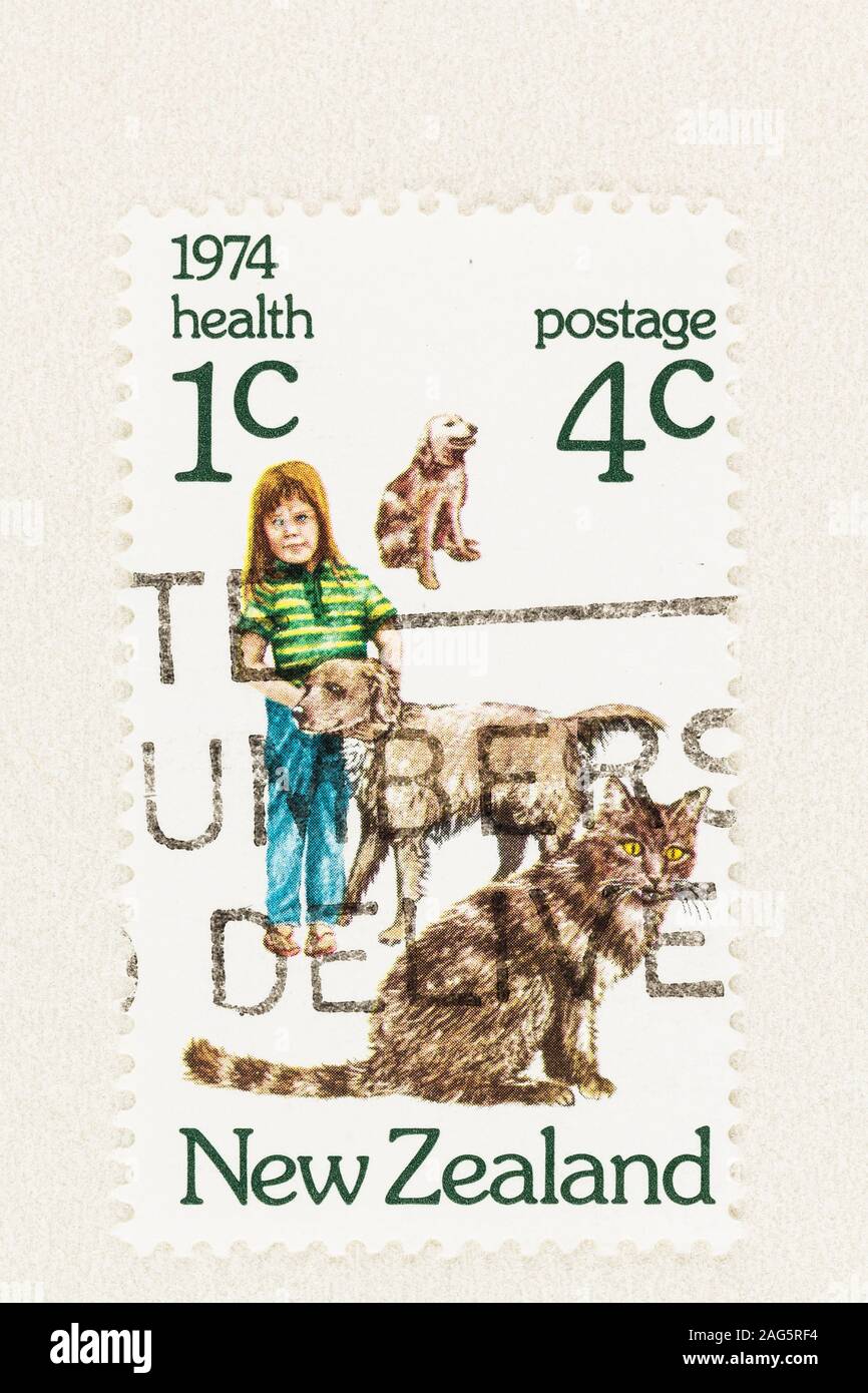 New Zealand 1c+4c Health stamp issued in 1974, featuring 2 dogs, a cat ...