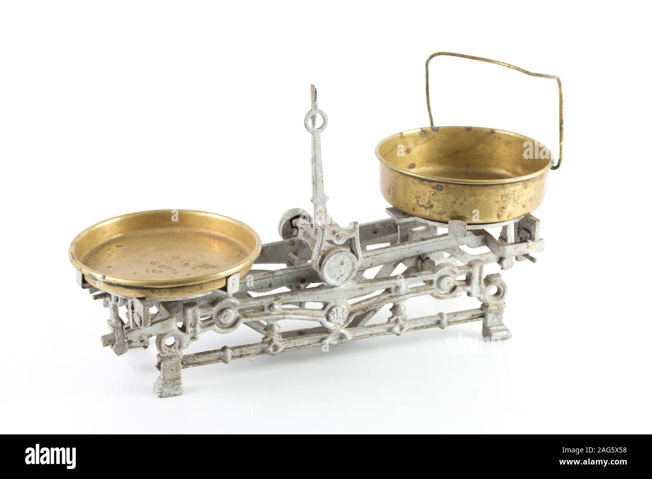 High angle shot of an old silver scale with golden containers isolated ...