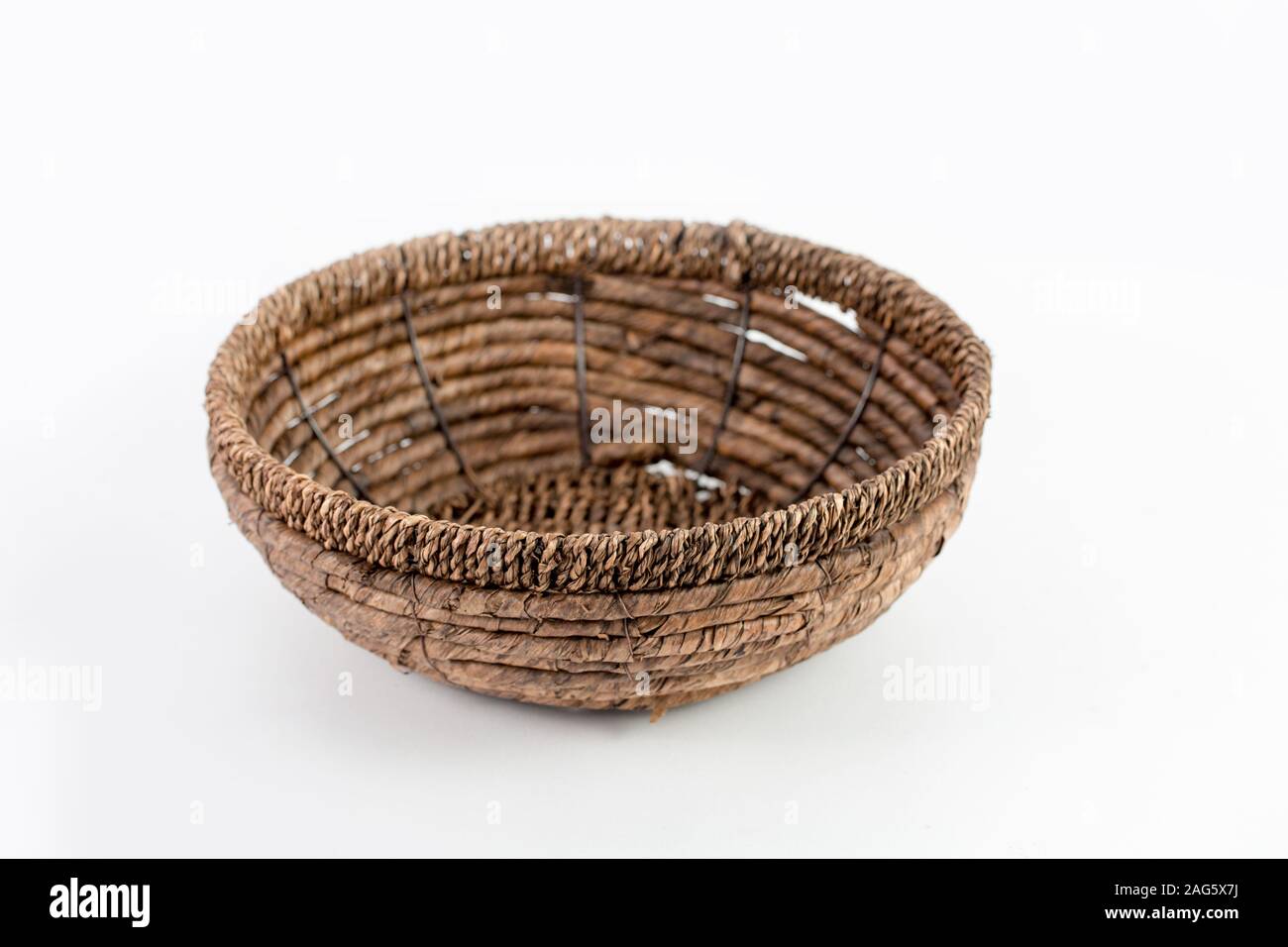 Weaved empty basket for fruits and vegetables isolated on a white ...