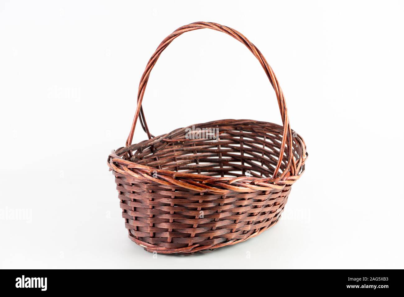 Weaved empty basket for fruits and vegetables isolated on a white ...