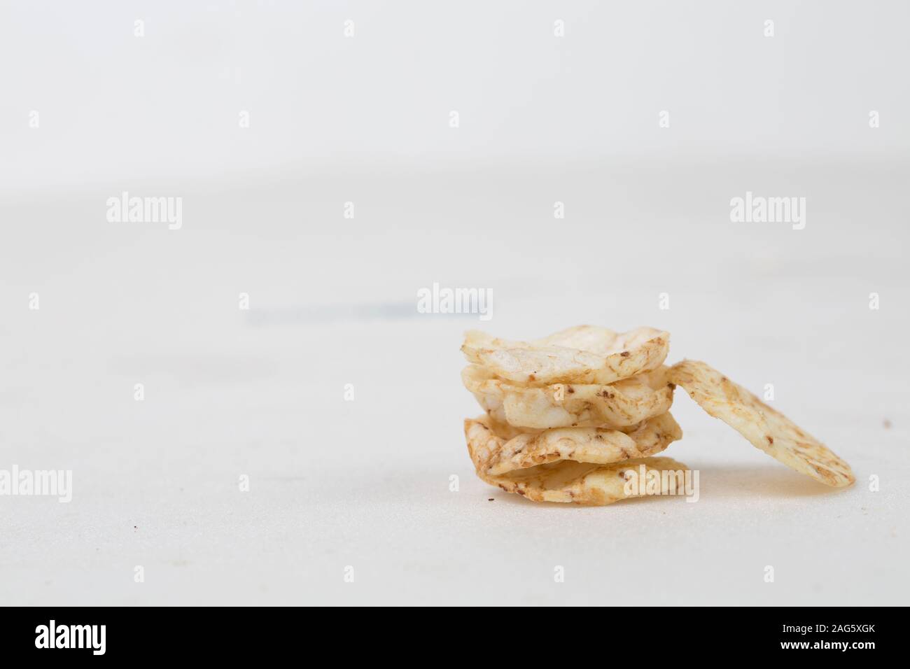 Closeup shot of a stack of pignolia isolated on a white background ...