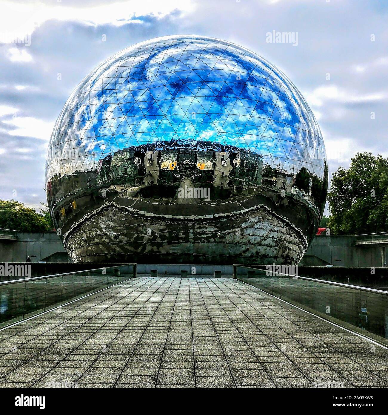 Beautiful shot of a scenery reflecting in a giant mirror ball under the ...