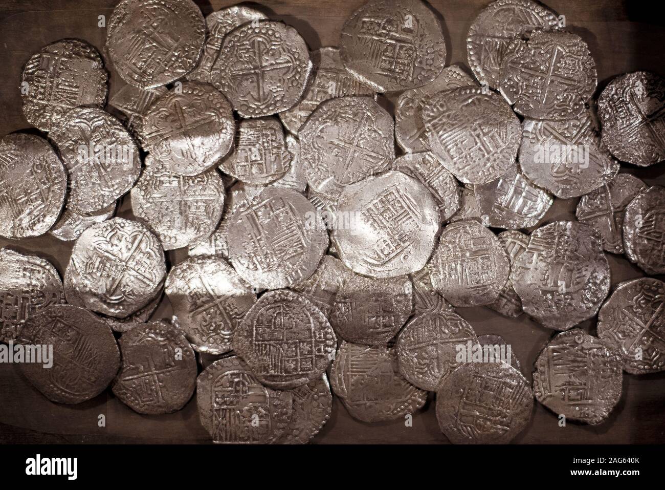 High angle shot of ancient silver coins with symbols - perfect for an ...