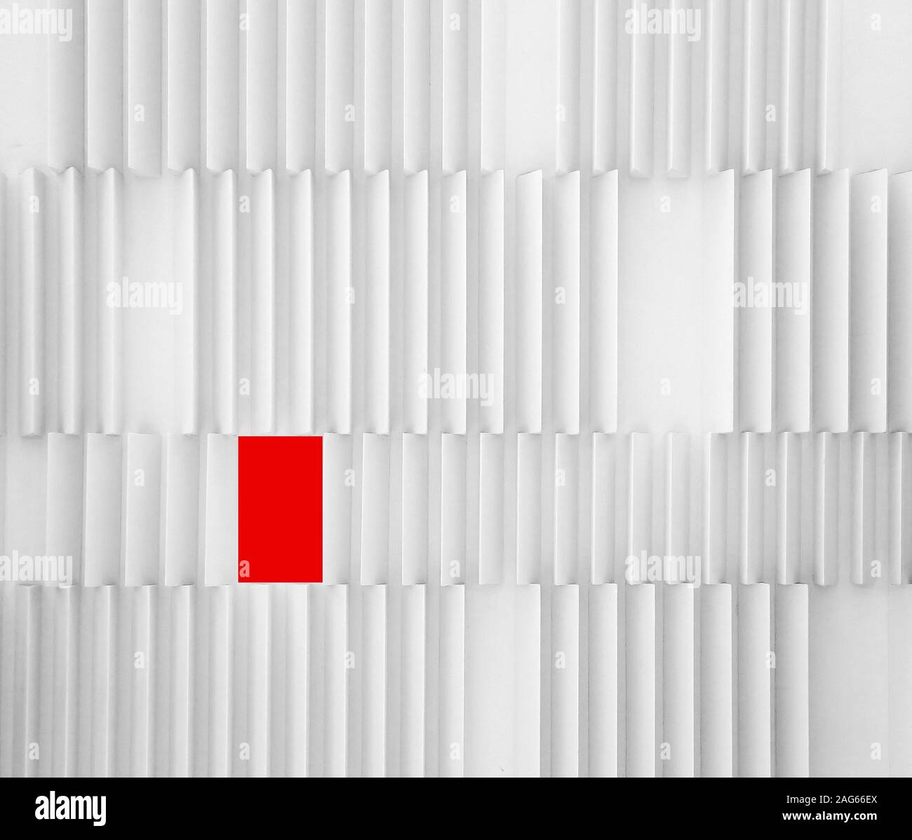 A cool white textured modern wall with a red different shaped rectangle ...