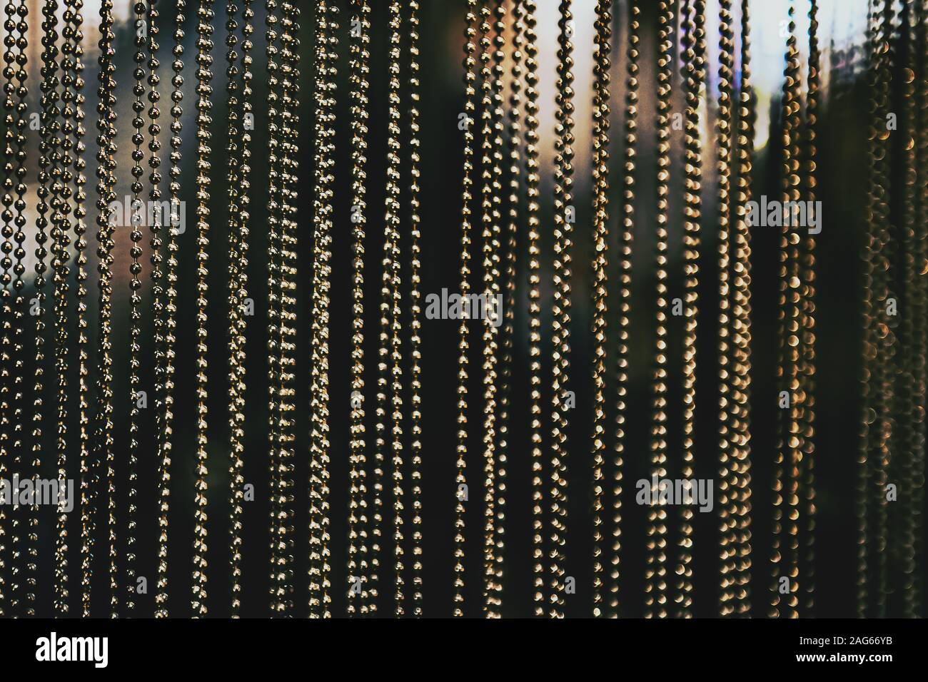 Decorative golden string curtain with a blurred background - great for ...