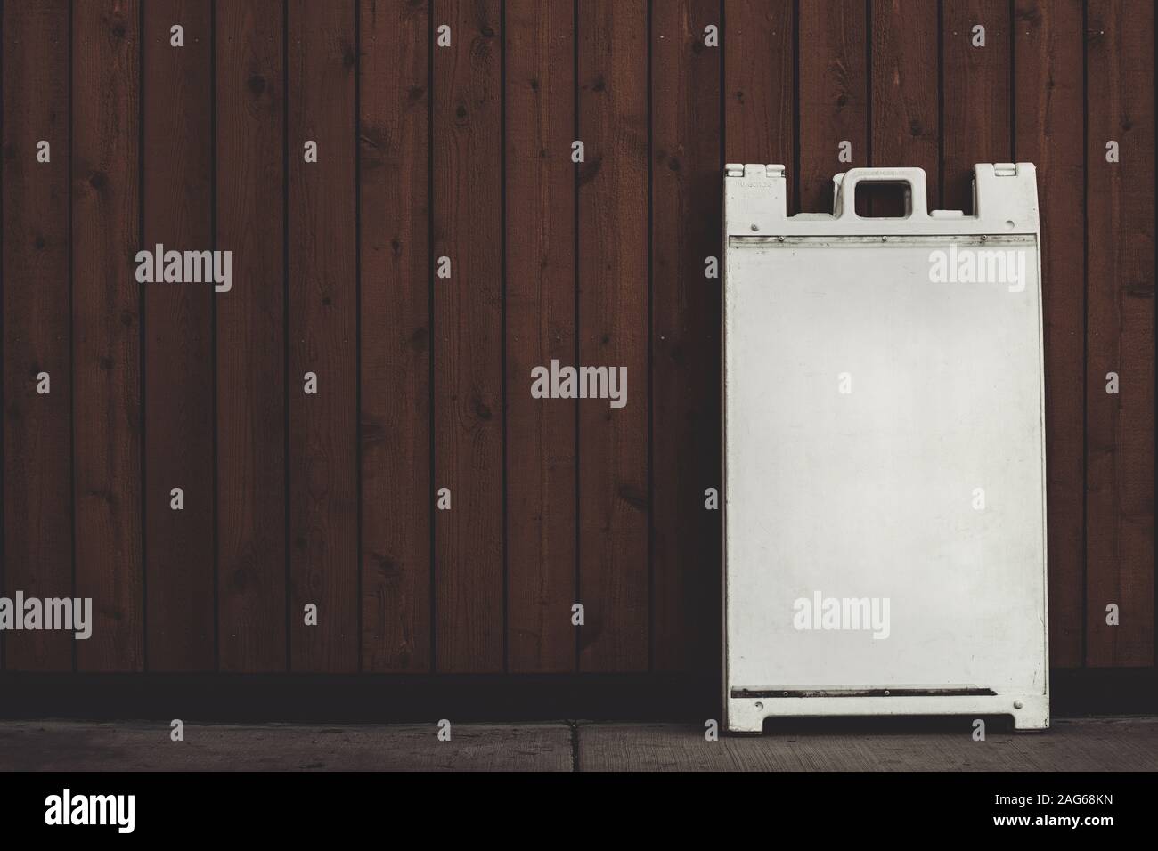 White folding table leaning on a brown wooden fence - great for ...