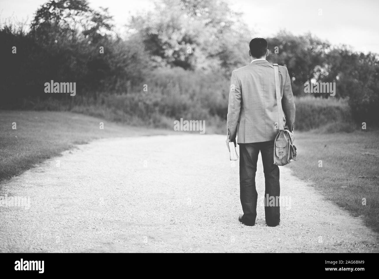 One man standing from behind Black and White Stock Photos & Images - Alamy