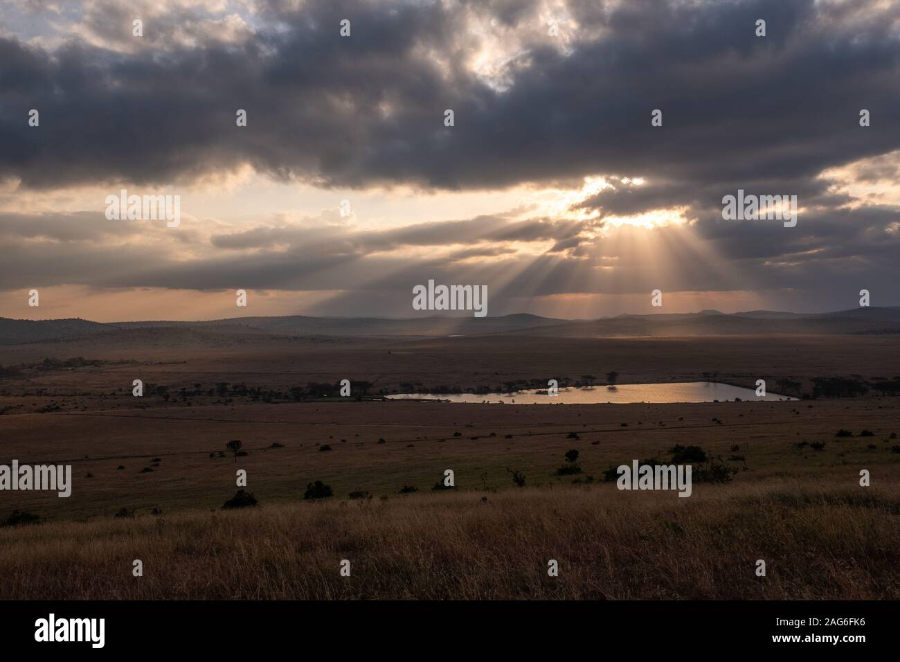 Sun shining in the cloudy sky over a lake in Kenya, Nairobi, Samburu ...