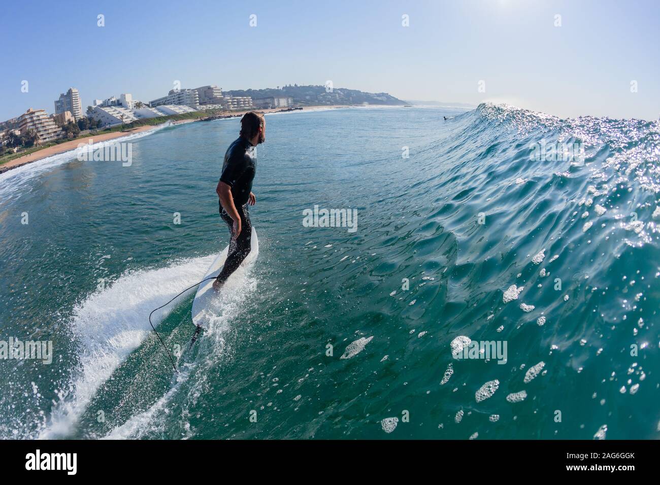 Surfing Surfer rear behind perspective water photo ocean wave ride into ...