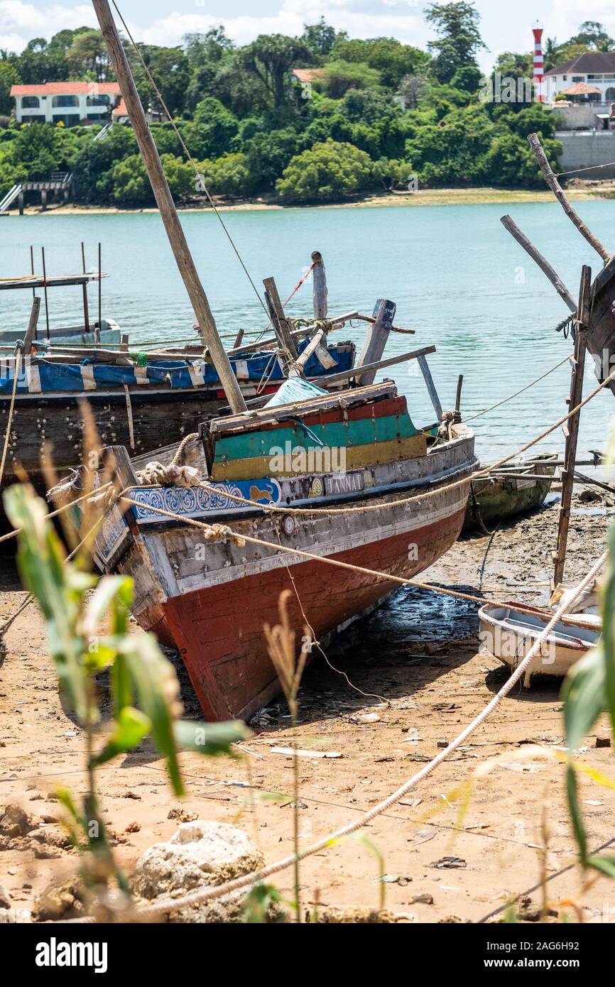 Vertical shot of rusted boats on the river bank captured in Mombasa ...